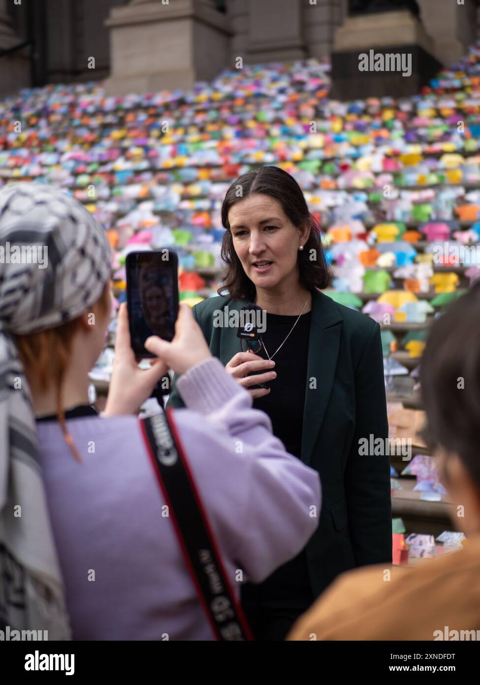 A volunteer takes photos of the leader of the Victorian Greens Ellen ...
