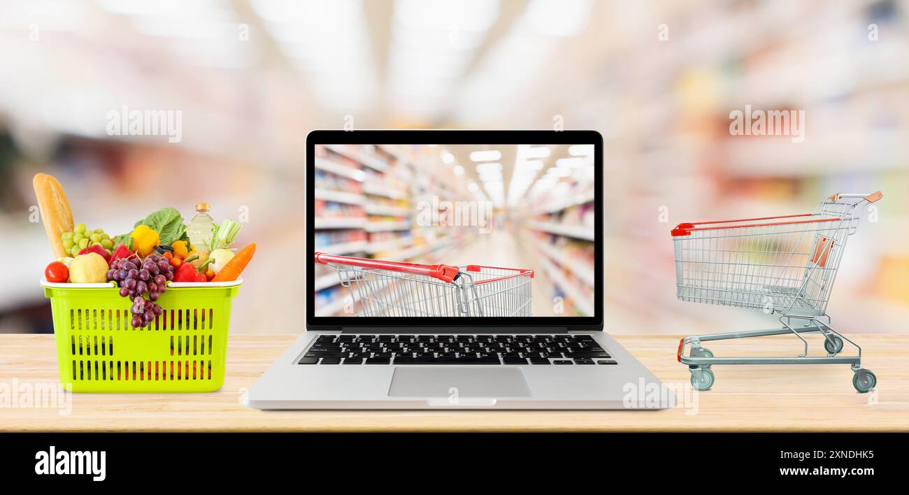 supermarket aisle blurred background with laptop computer and shopping ...