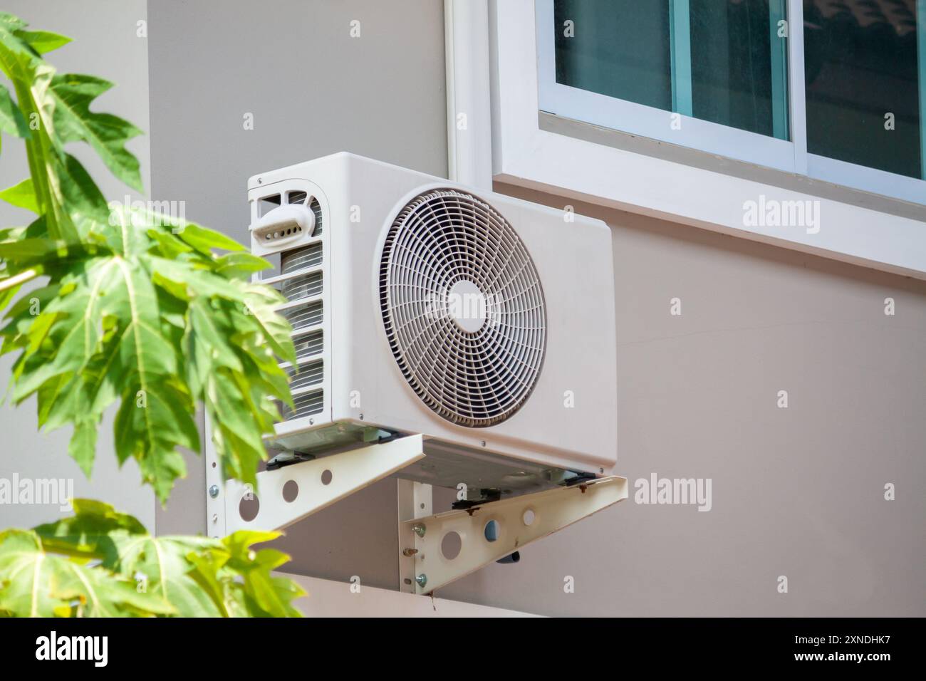 Air conditioner compressor outdoor unit installed outside the house ...