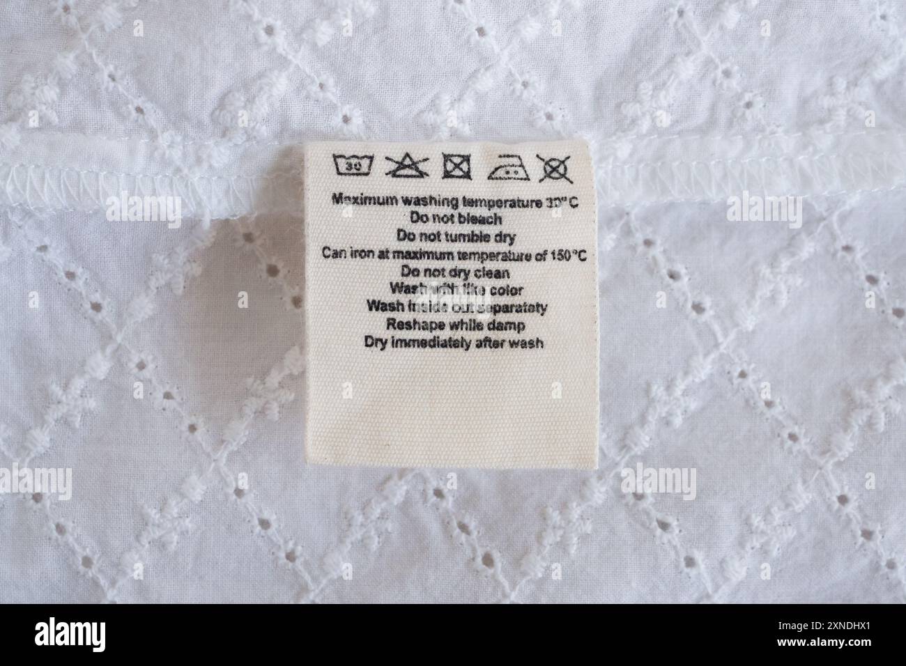 laundry care washing instructions clothes label on fabric texture ...