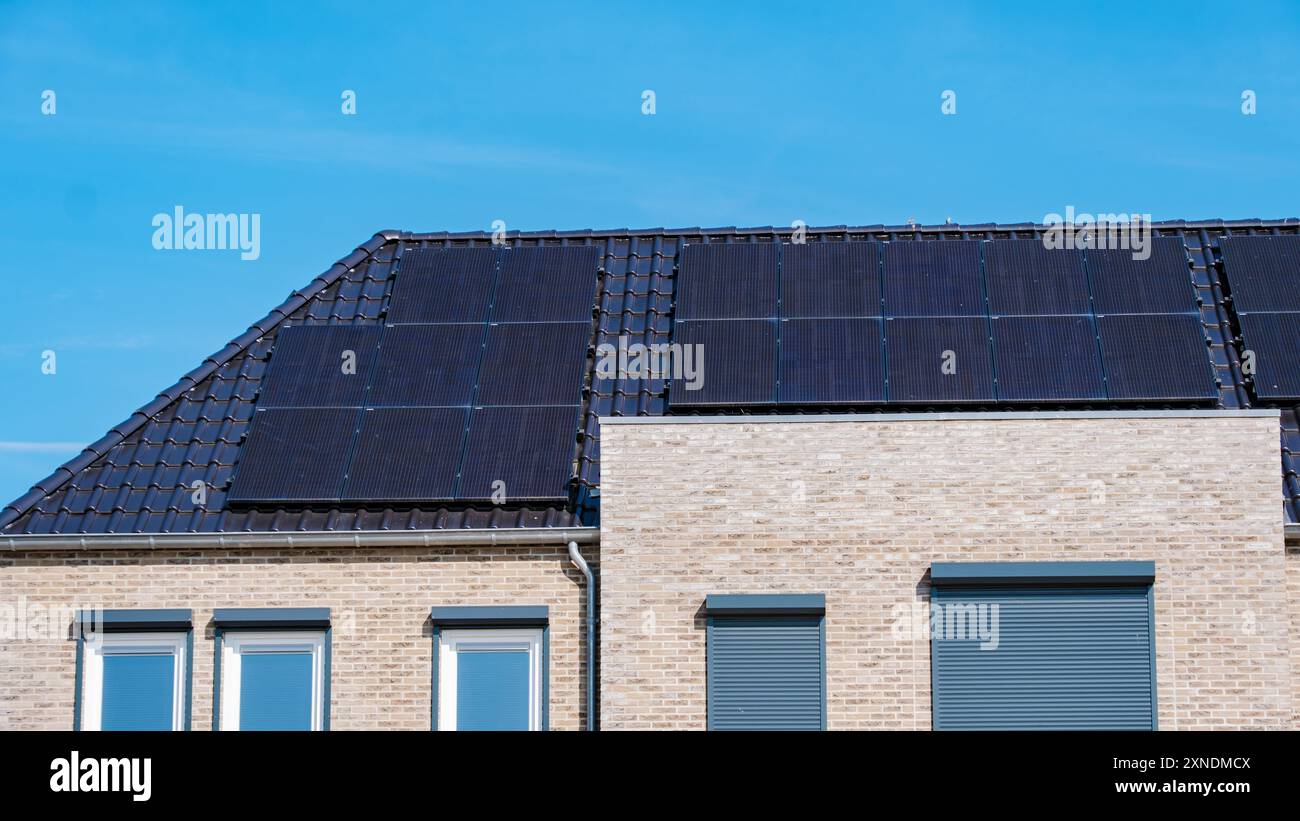 modern home showcases multiple solar panels on its roof, harnessing ...