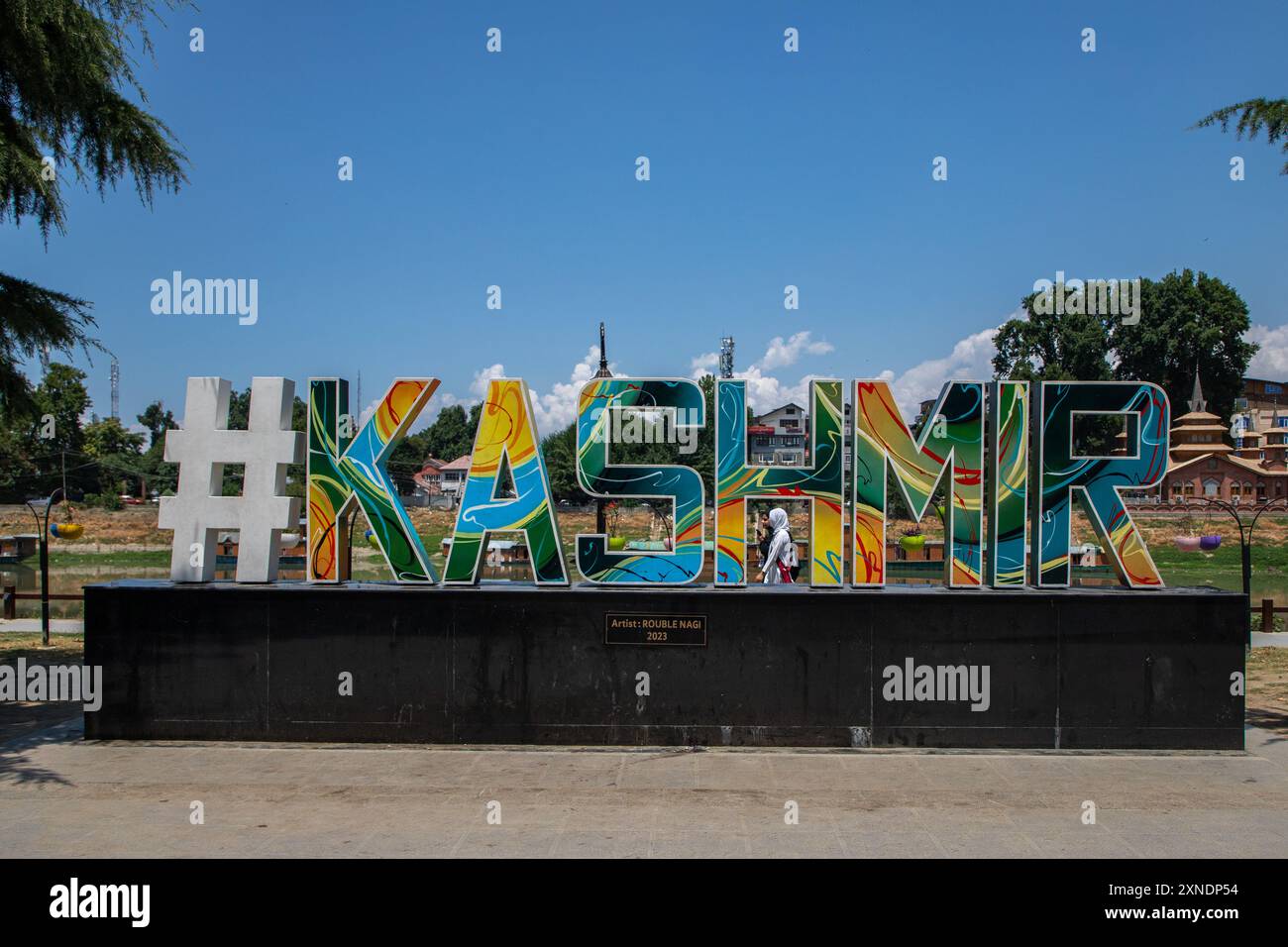 Kashmiri collage girls walk along a path on a hot summer day in ...