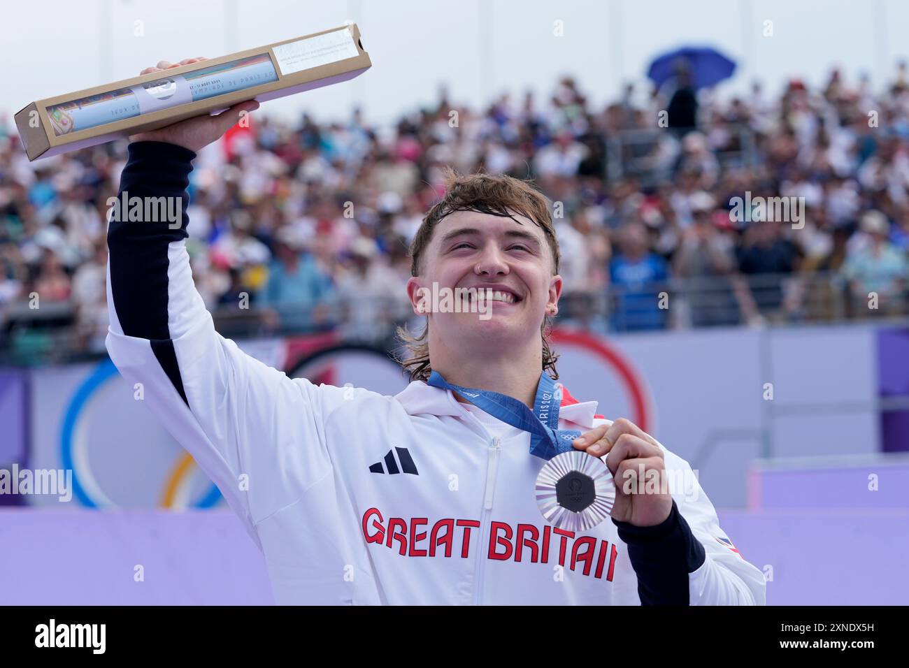 Kieran Darren David Reilly, of Britain, poses after winning the silver medal in the cycling BMX ...
