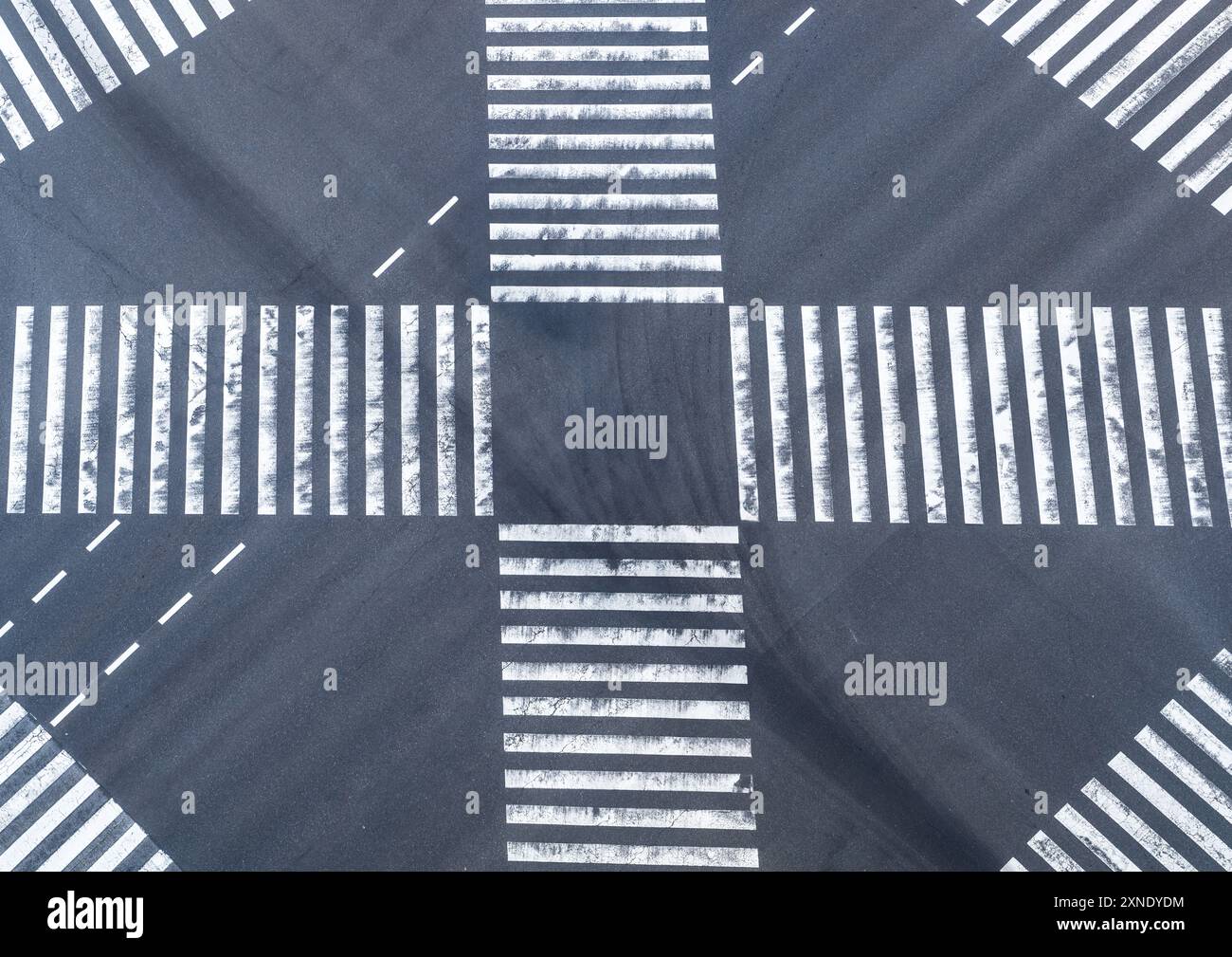 Aerial view of a crosswalk with white stripes on the road Stock Photo ...