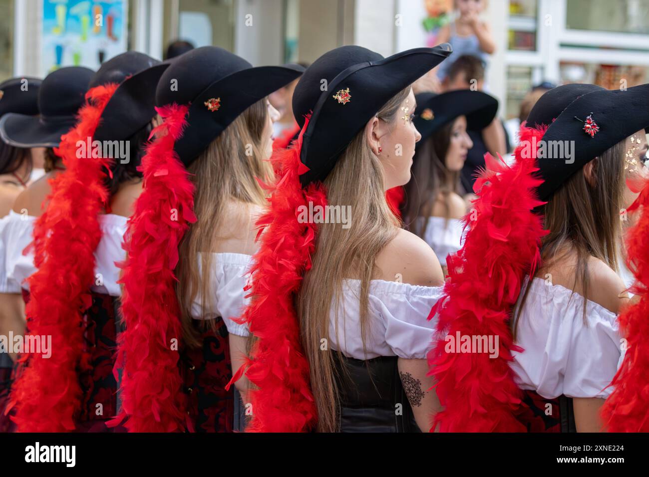 This image captures a group of women parading during the Moros y ...