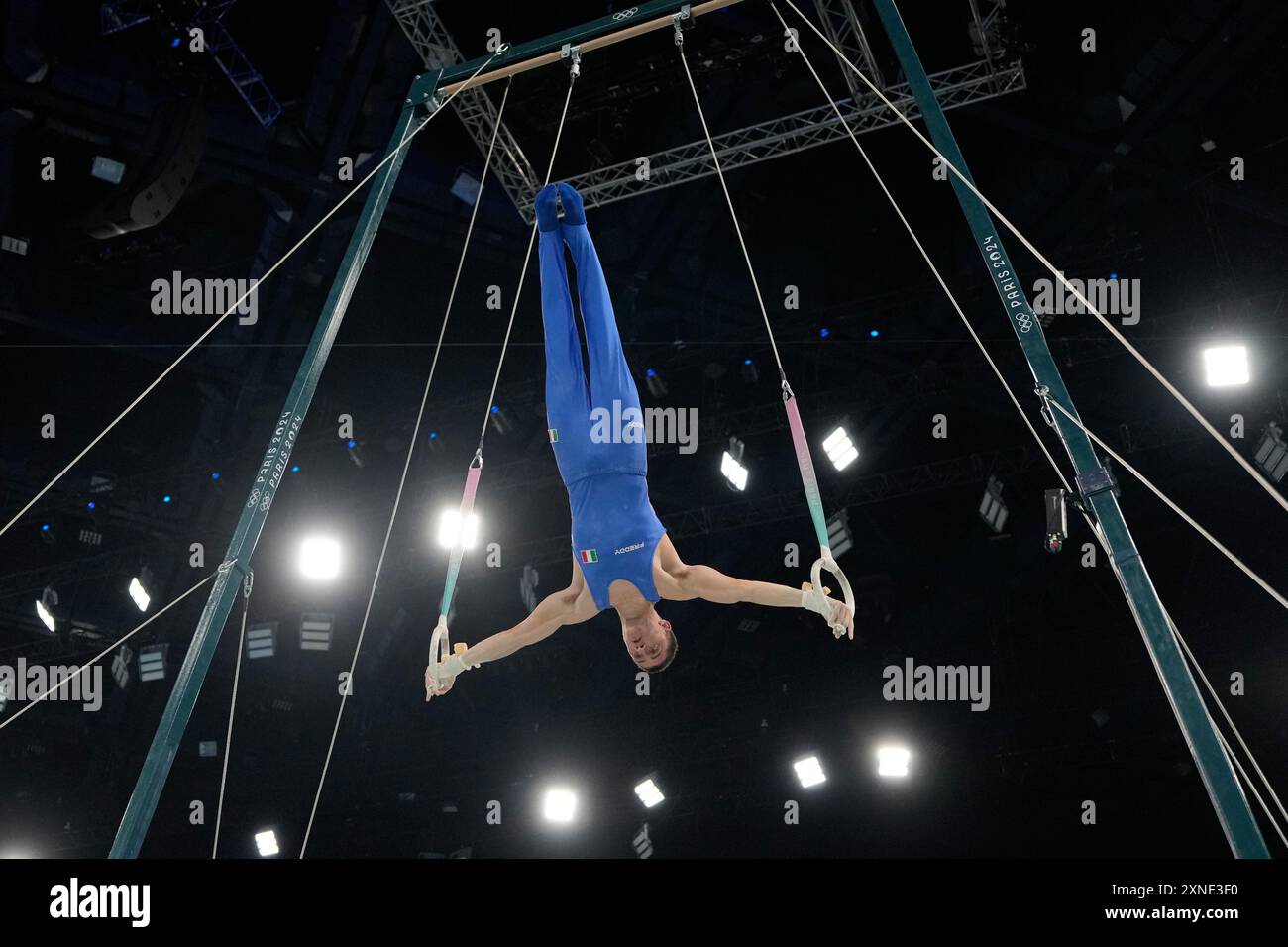 Mario Macchiati, of Italy, performs on the rings during the men's ...