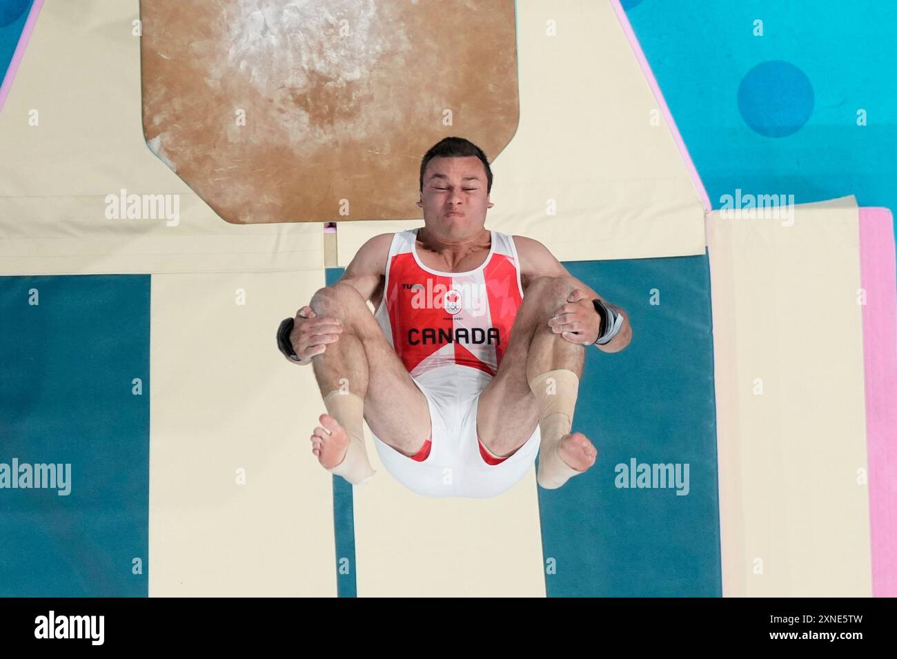 Rene Cournoyer, of Canada, performs on the rings during the men's ...