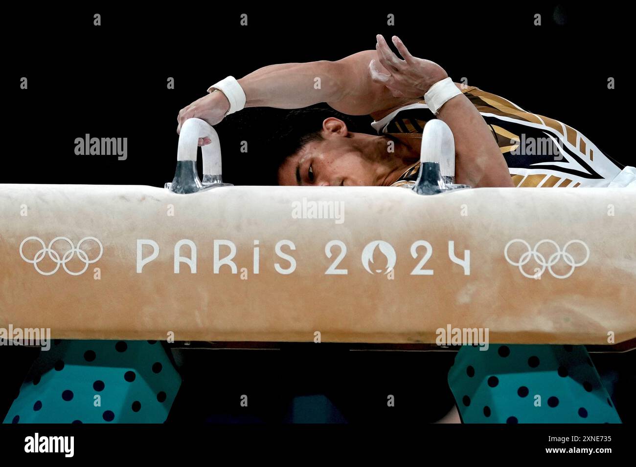 Carlos Edriel Yulo, of the Philippines, falls off the pommel horse ...
