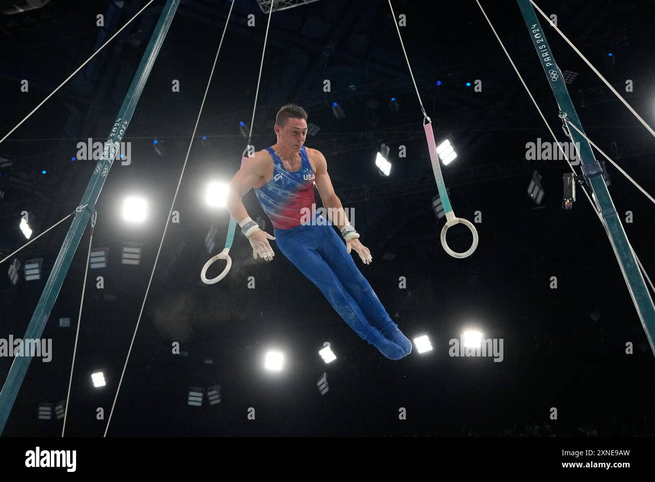 Paul Juda, of the United States, performs on the rings during the men's ...