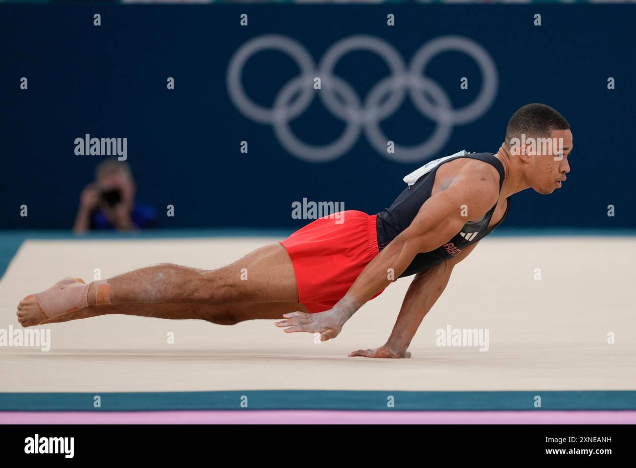 Joe Fraser, of Britain, performs on the floor during the men's artistic ...