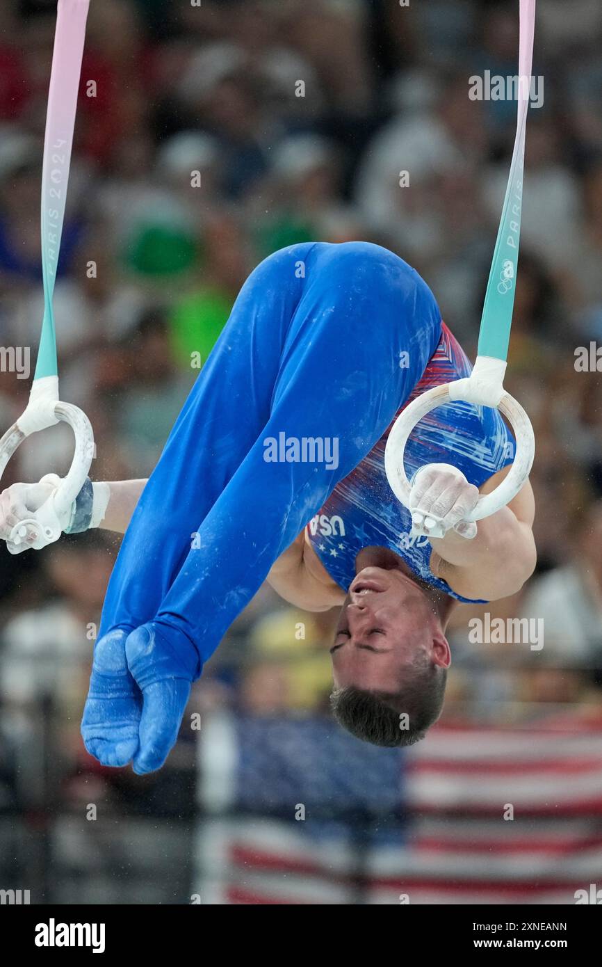 Paul Juda, of the United States, performs on the rings during the men's ...