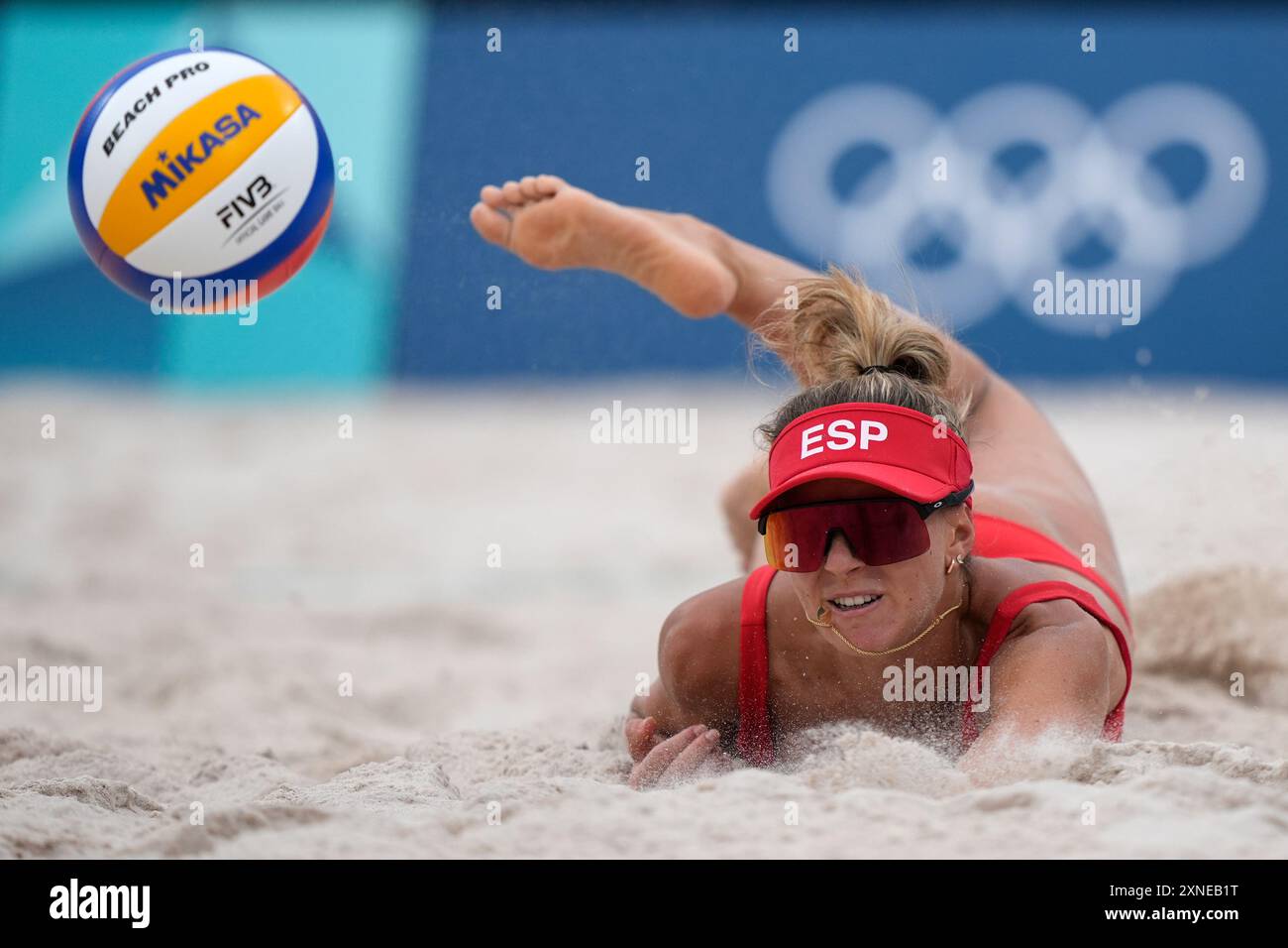 Spain's Tania Moreno dives to make a save in a beach volleyball match ...