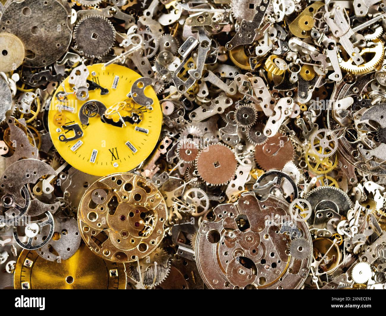 Full frame of gears, clock faces and metal parts of internal mechanism ...