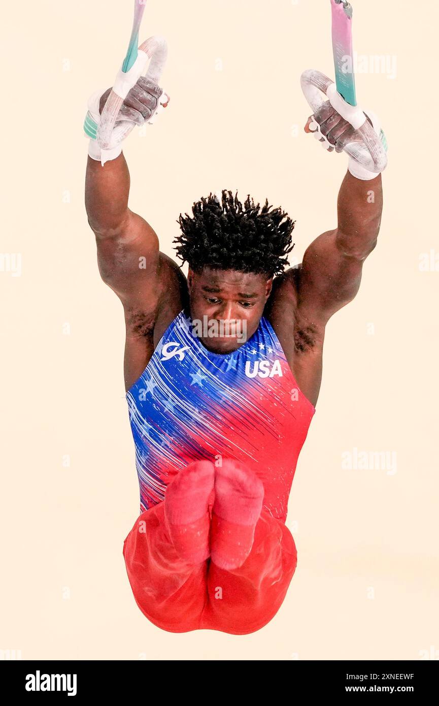 Frederick Richard, of the United States, performs on the rings during ...