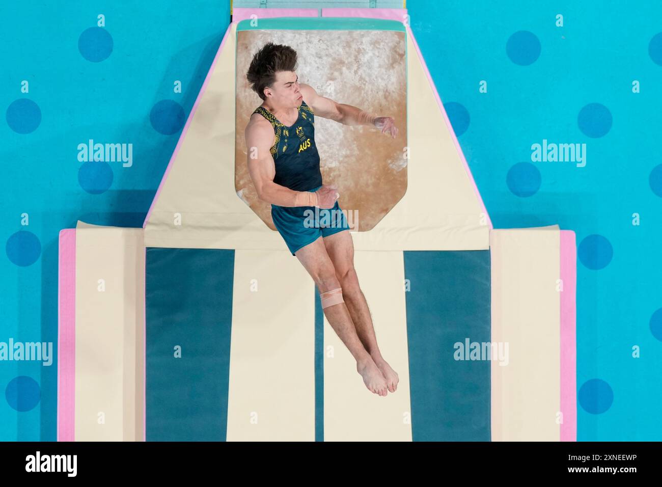 Jesse Moore, of Australia, performs on the vault during the men's ...
