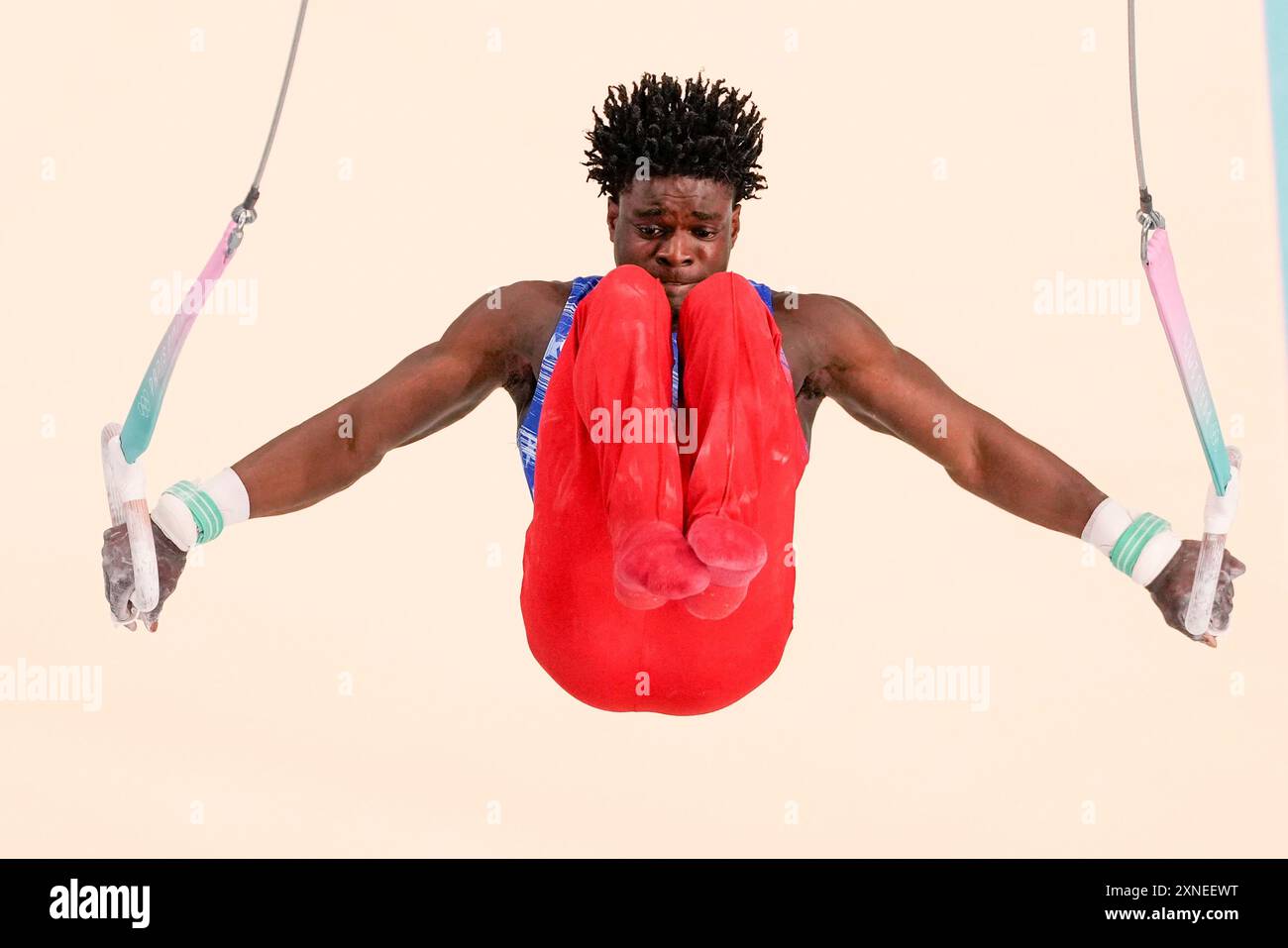 Frederick Richard, of the United States, performs on the rings during ...