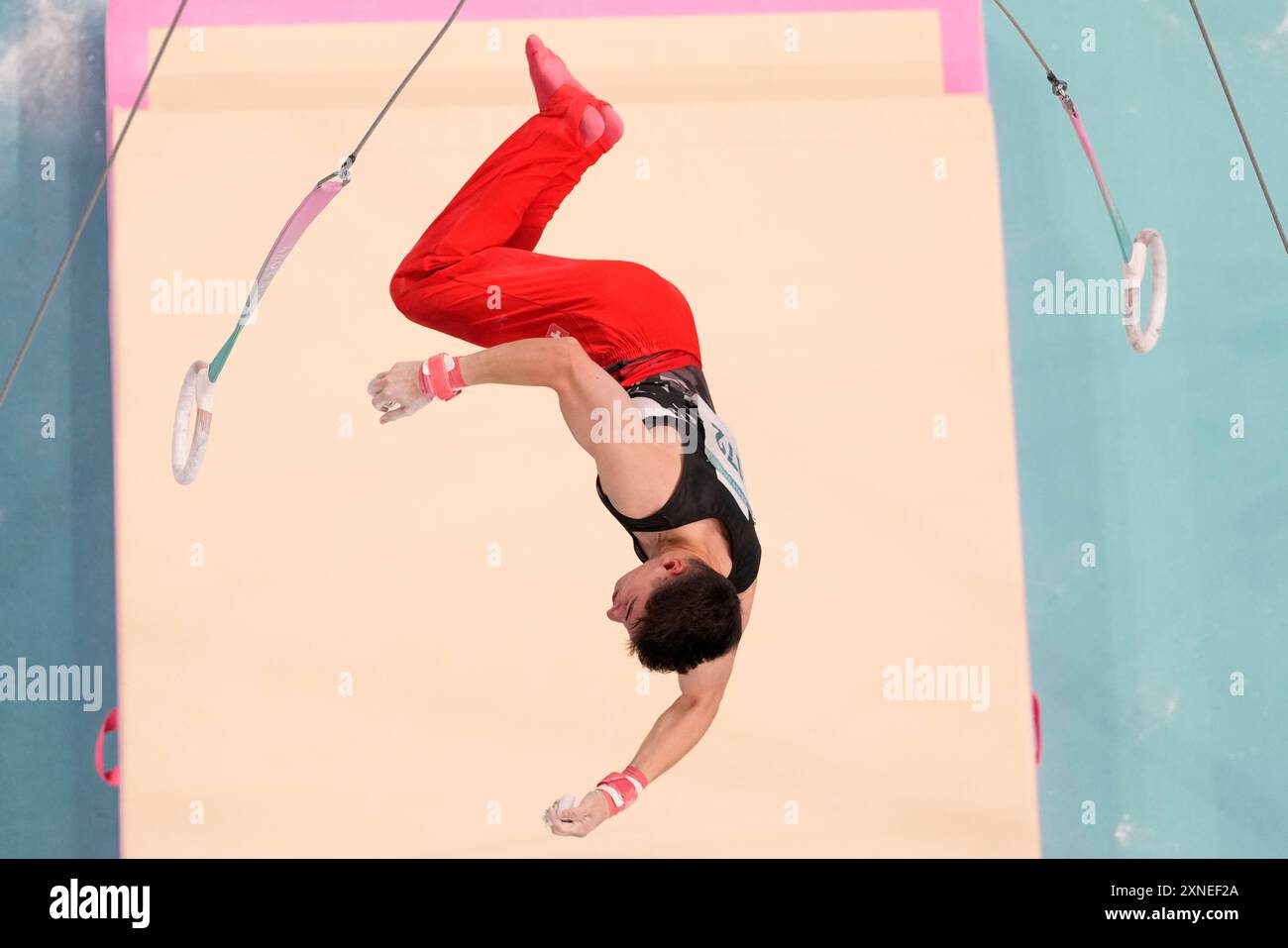 Matteo Giubellini, of Switzerland, performs on the rings during the men ...