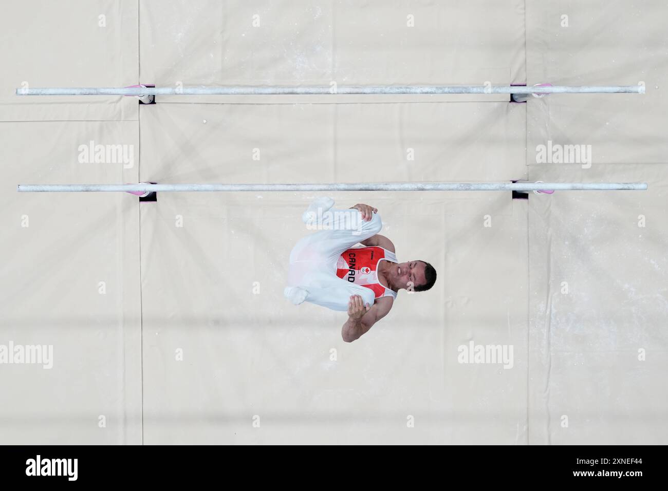 Rene Cournoyer, of Canada, performs on the parallel bars during the men ...