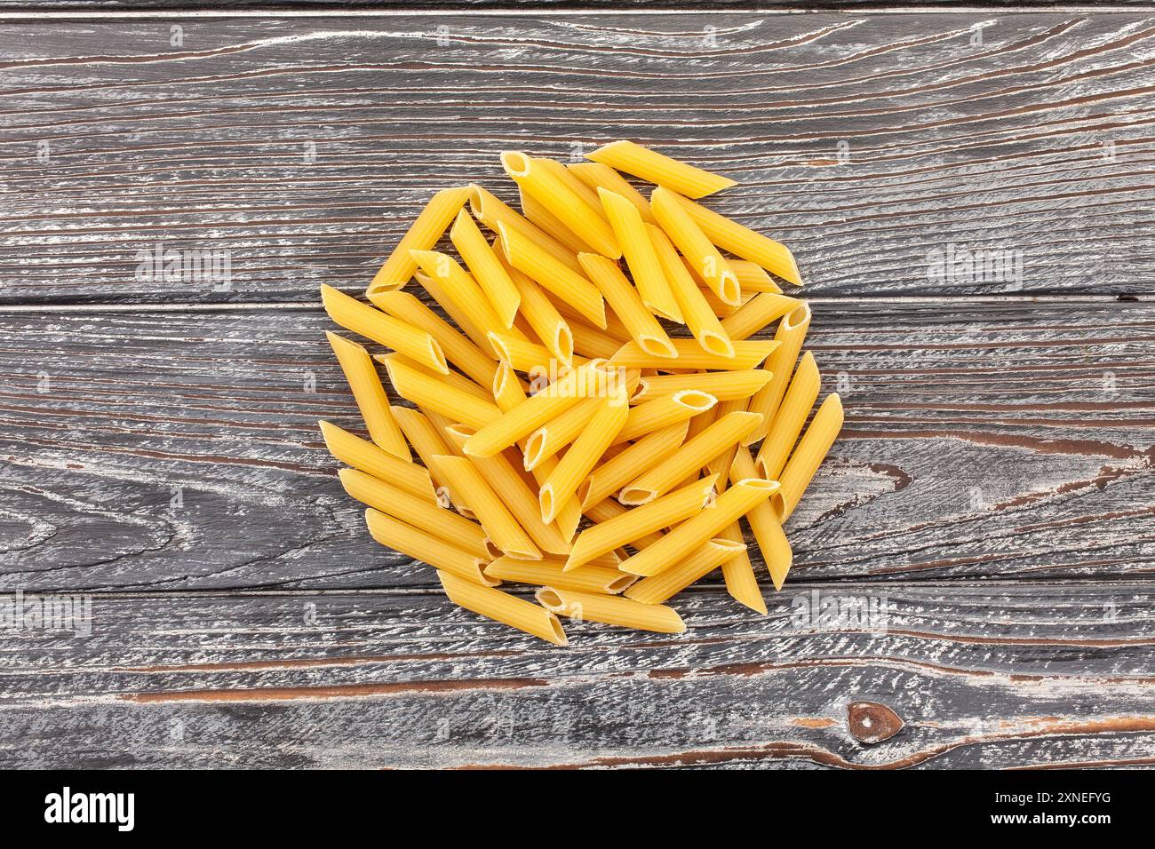 Raw whole dry penne rigate hi-res stock photography and images - Alamy