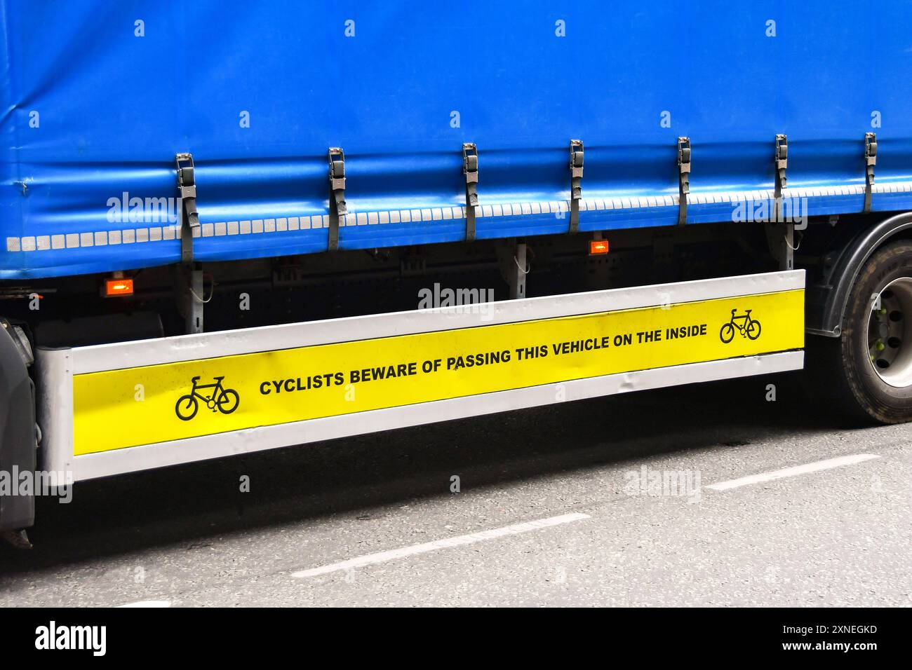 Warning sign to cyclists on the side of a large lorry. No people. Road ...