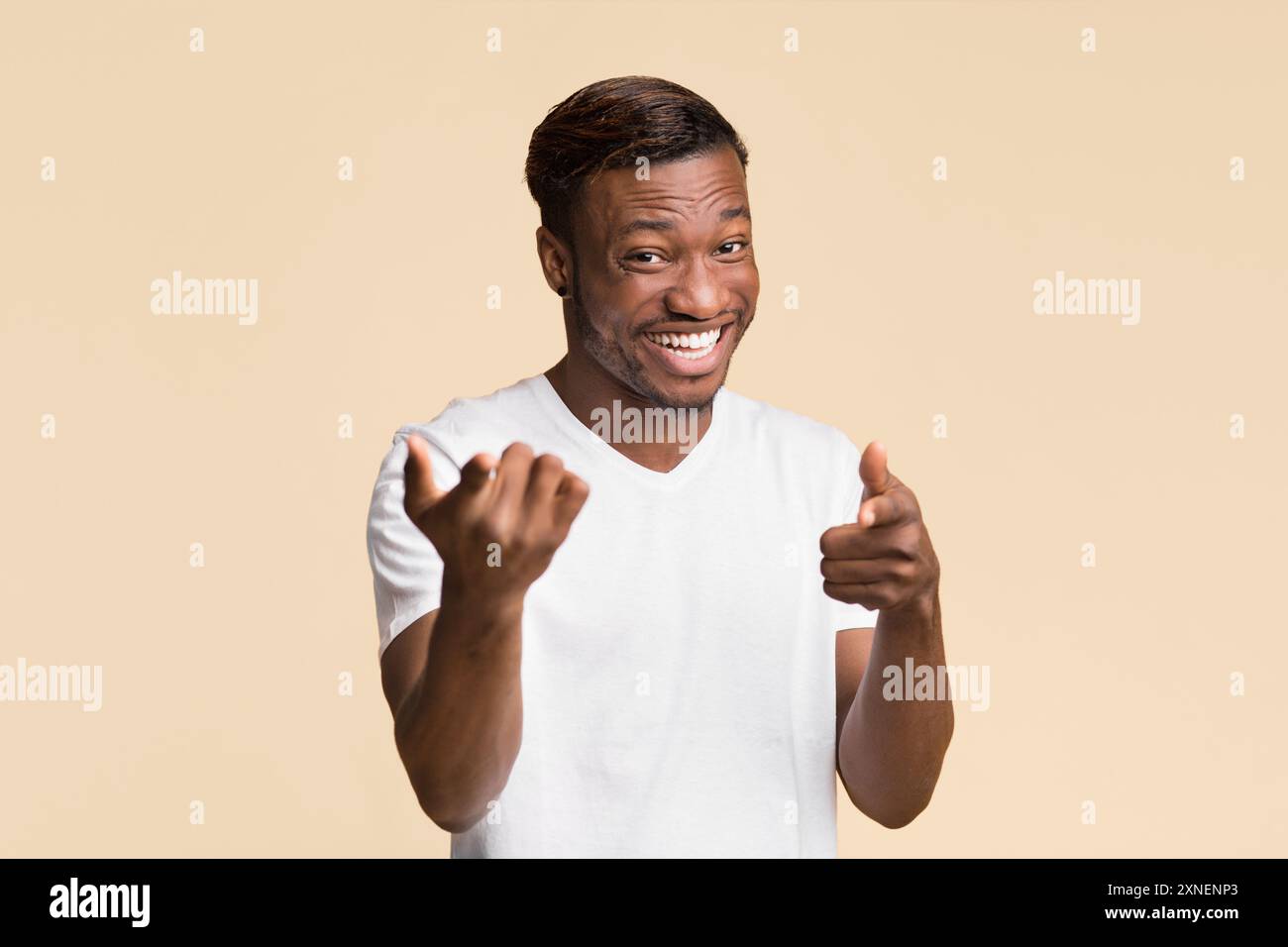 Funny Afro Guy Pointing Fingers At Camera, Studio Shot Stock Photo - Alamy