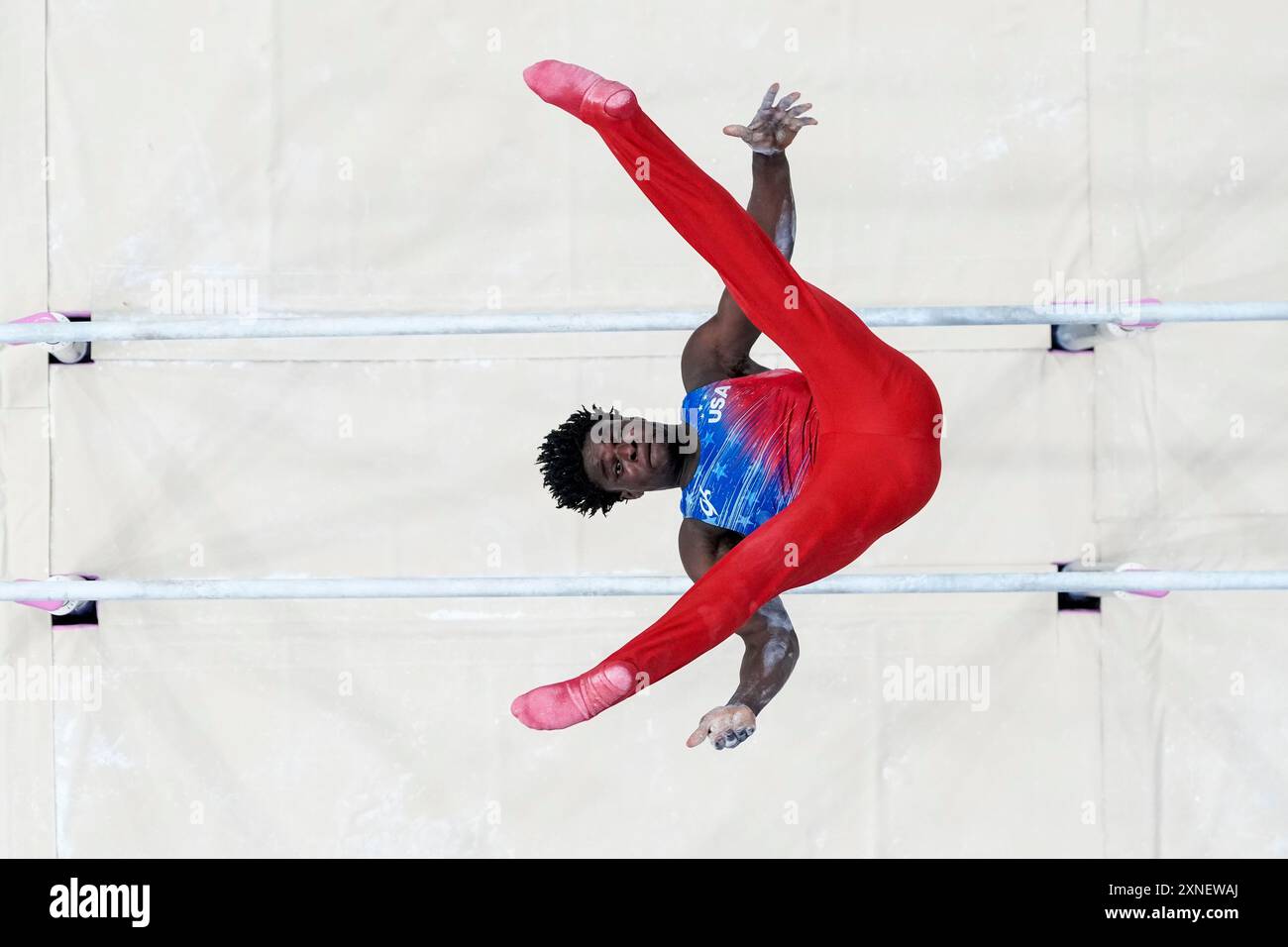Frederick Richard, of the United States, performs on the parallel bars ...