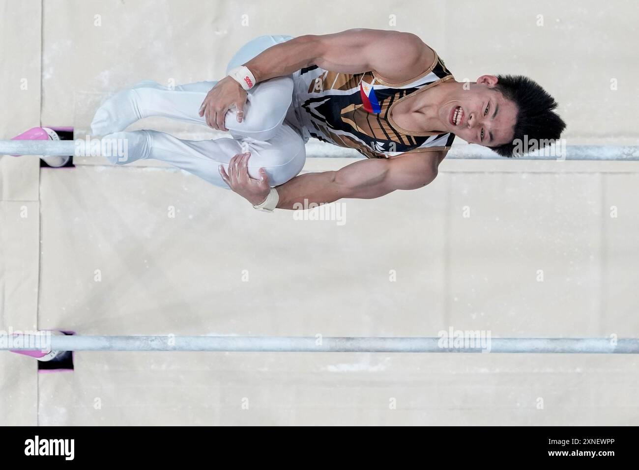 Carlos Edriel Yulo, of the Philippines, performs on the parallel bars ...