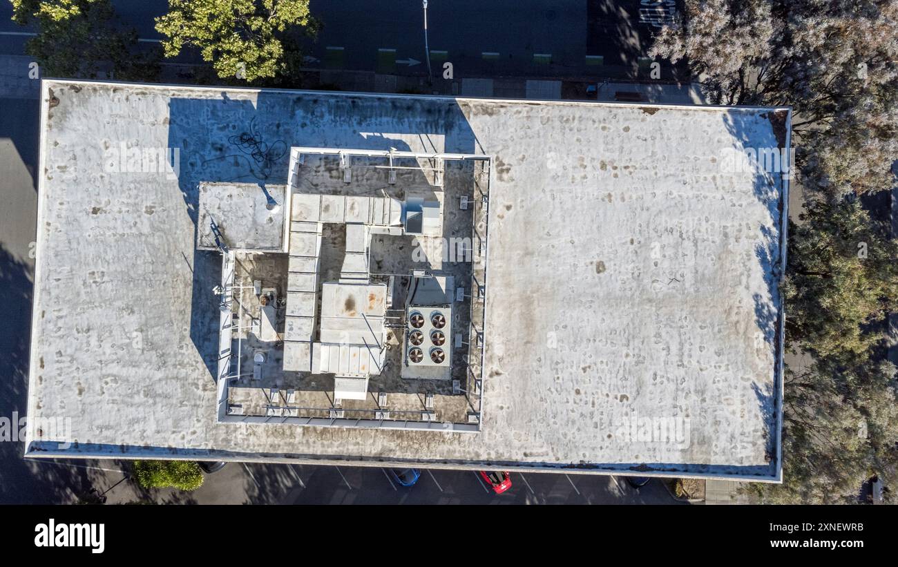 Aerial view of a flat commercial rooftop with air vents and air ...