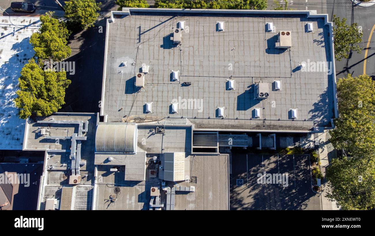 Aerial view of a flat commercial rooftop with air vents and air ...