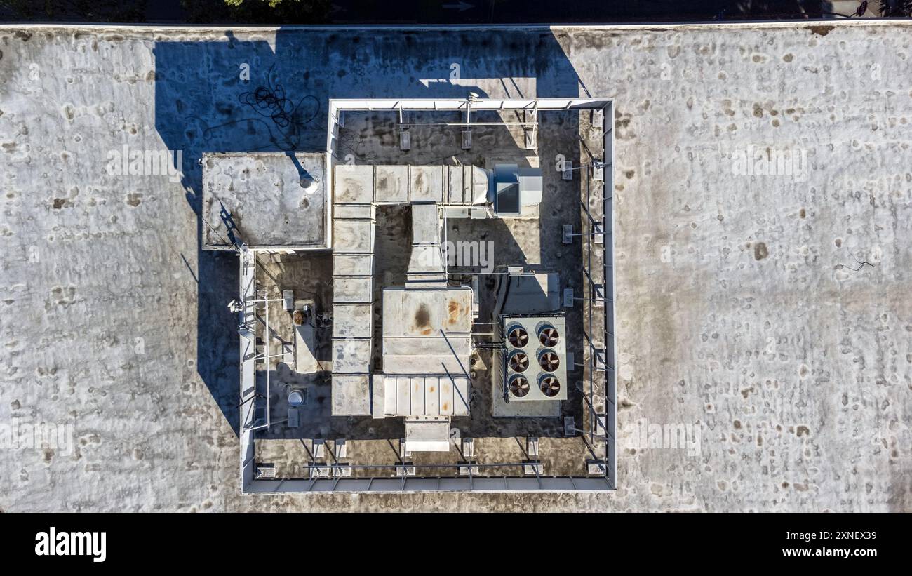 Aerial view of a flat commercial rooftop with air vents and air ...