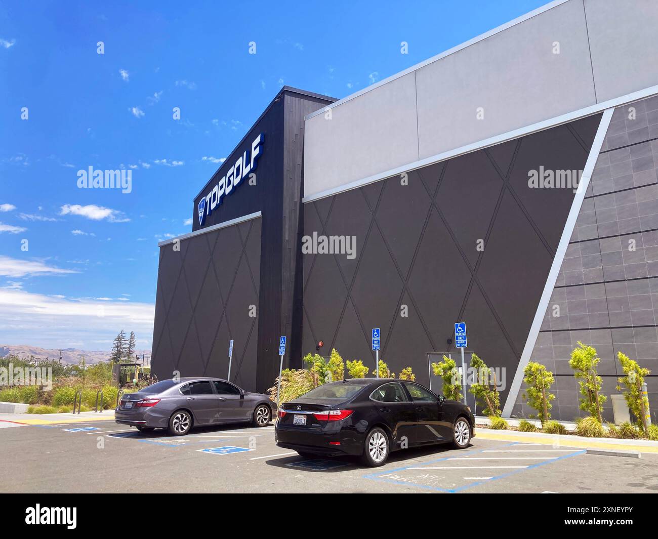 Topgolf sign, logo on the building facade of sport entertainment venue ...