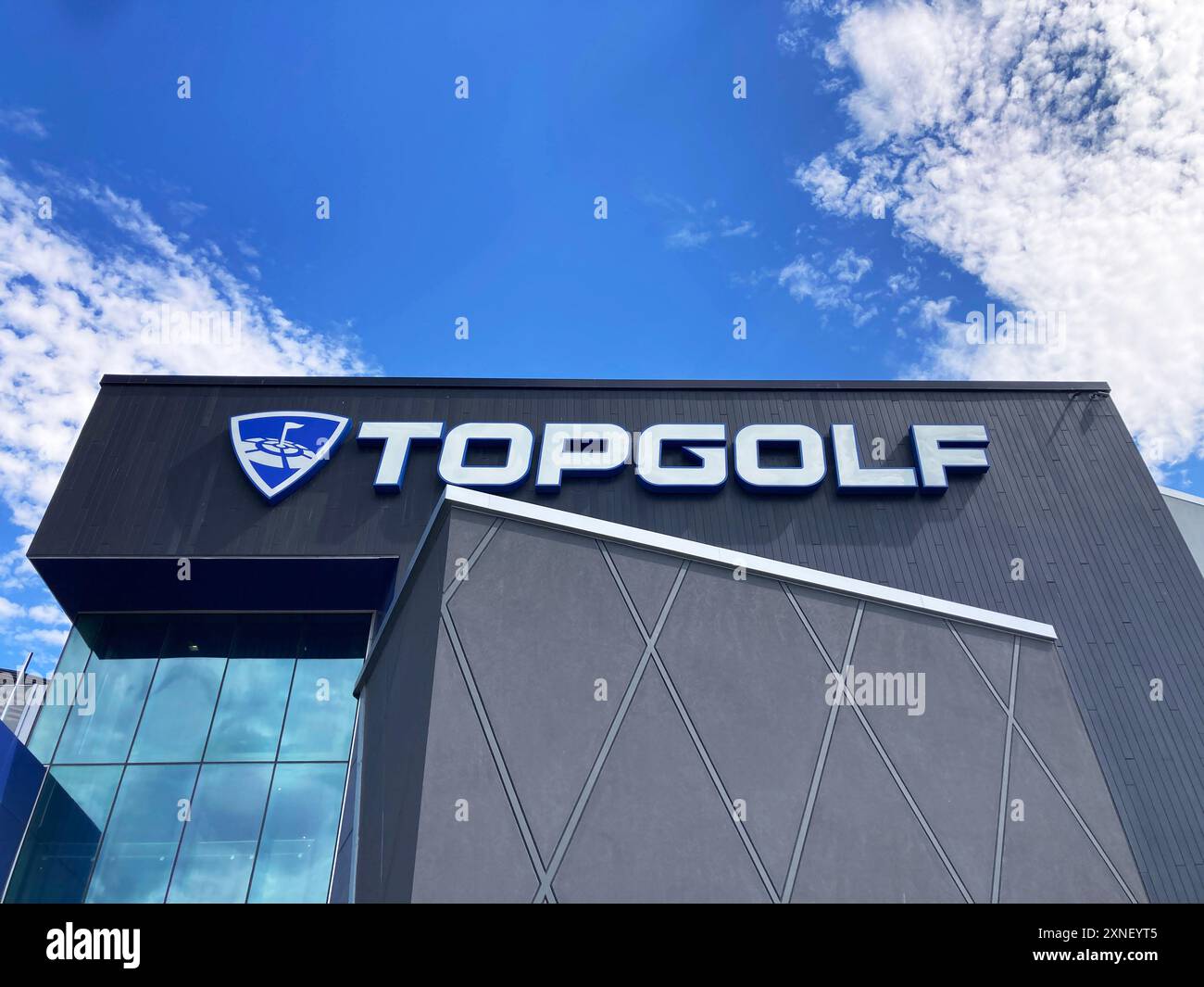 Topgolf sign, logo on the building facade of sport entertainment venue ...
