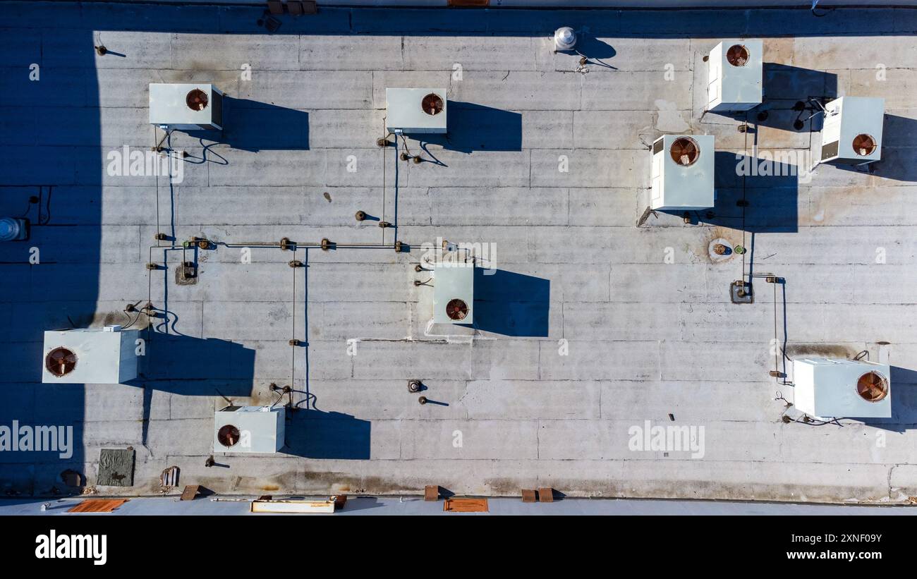 Aerial top down view of a flat roof of a commercial building with ...