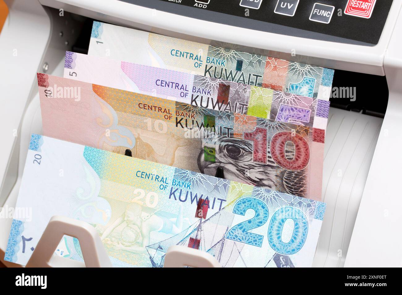 Kuwaiti money - dinar in the counting machine Stock Photo - Alamy