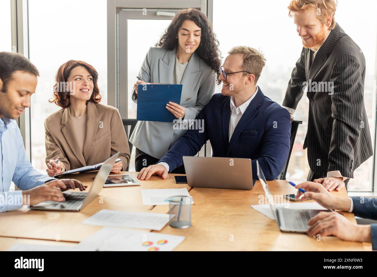 Business Professionals Collaborating Around a Table in a Modern Office ...