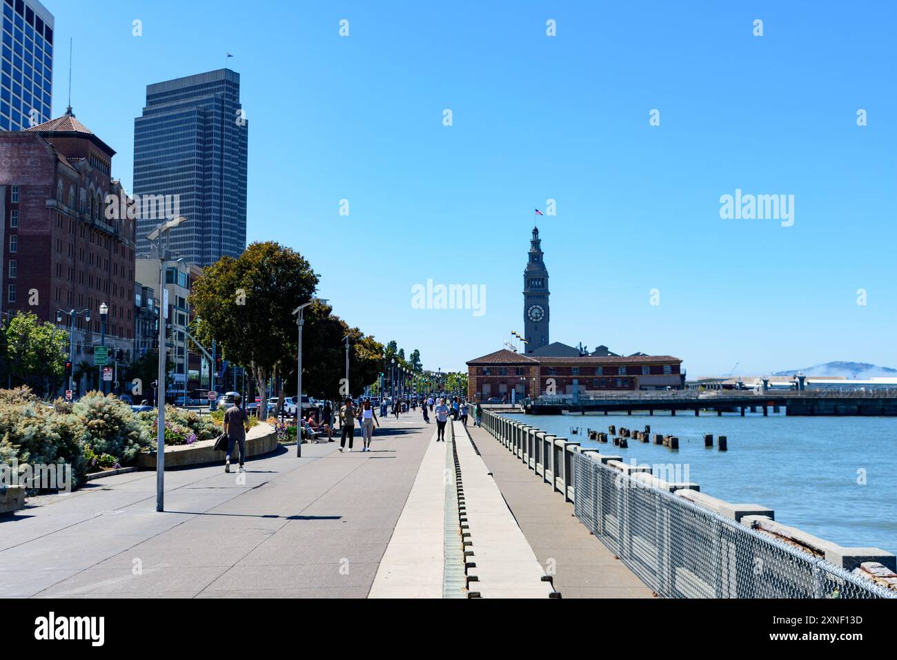 A waterfront promenade along Embarcadero leads to a distant Ferry ...
