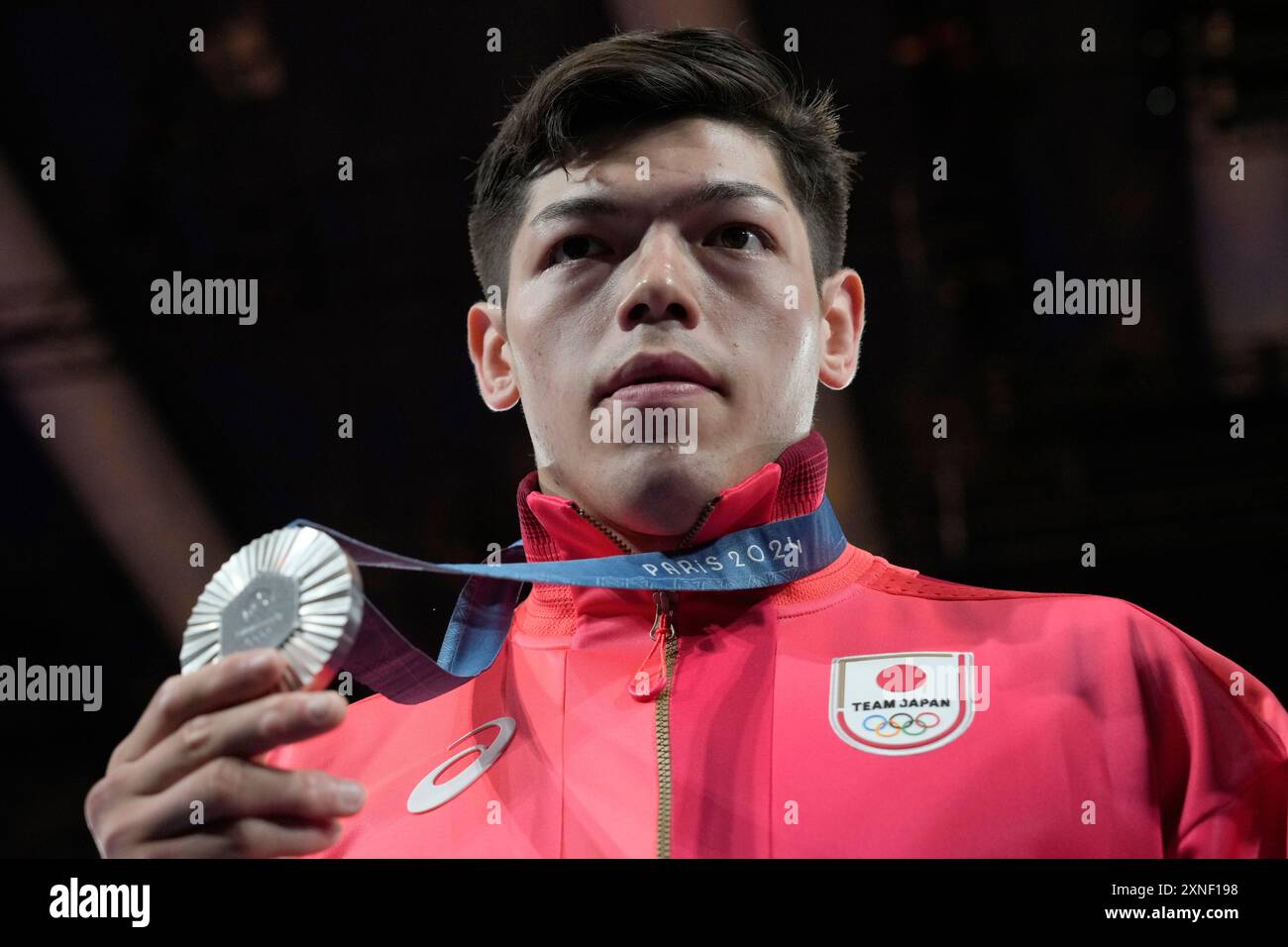 Silver medalist Japan's Sanshiro Murao poses after the men's -90kg ...