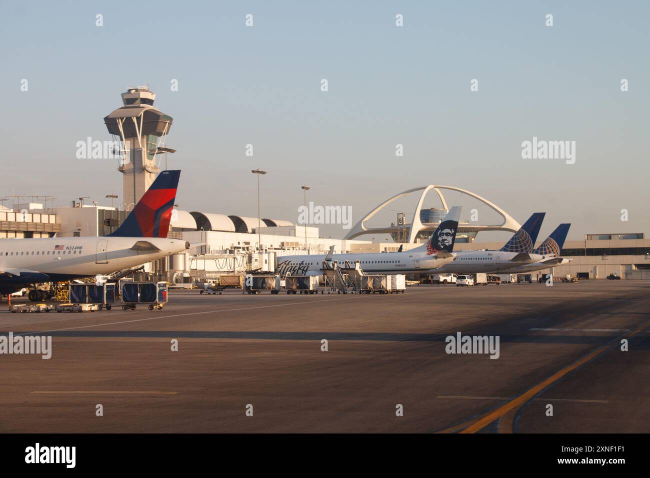 Airplanes parked in LAX Los Angeles Airport, the control tower and the ...