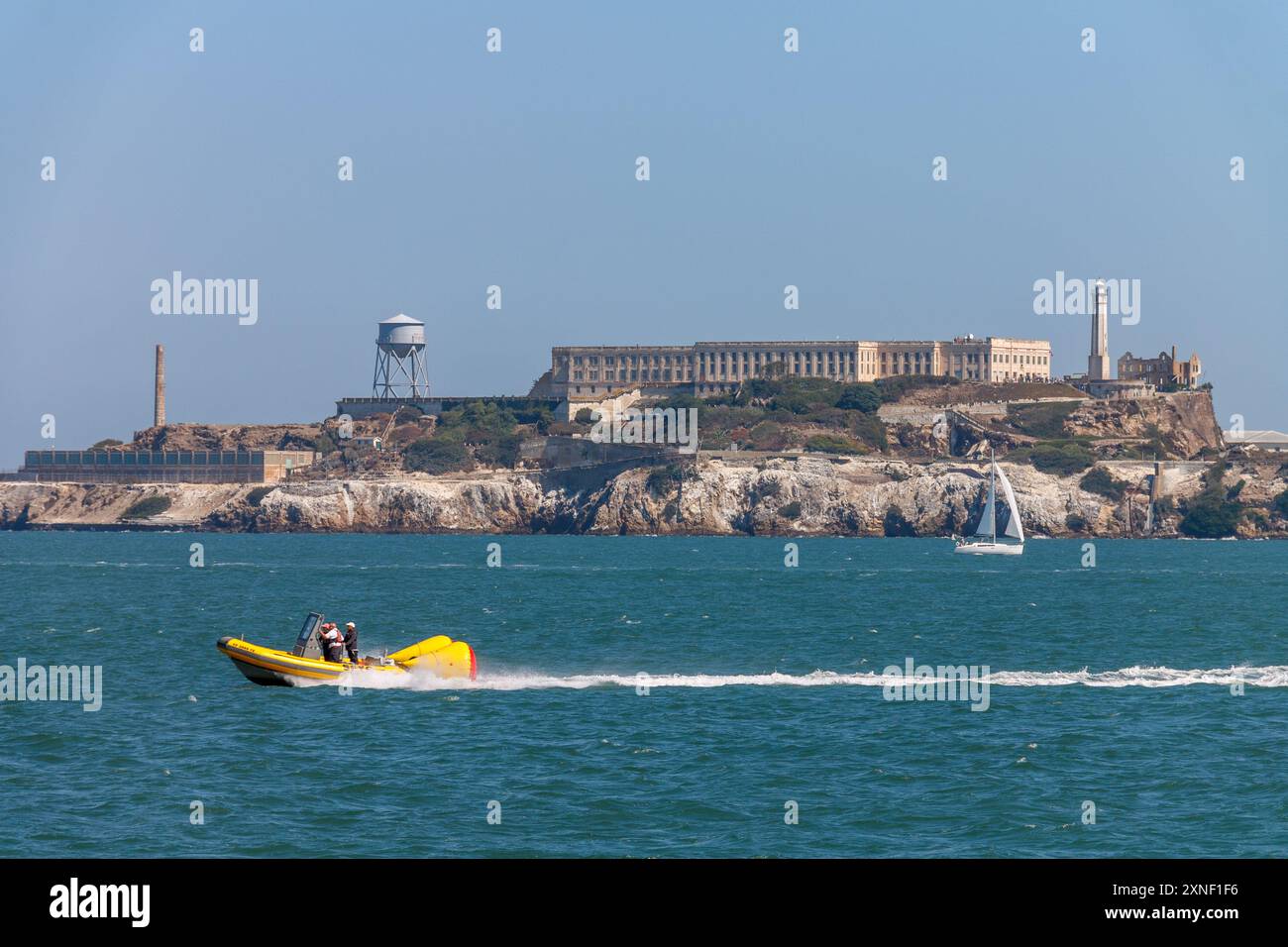 Boats and Alcatraz prison on the rock, San Francisco Bay, California ...