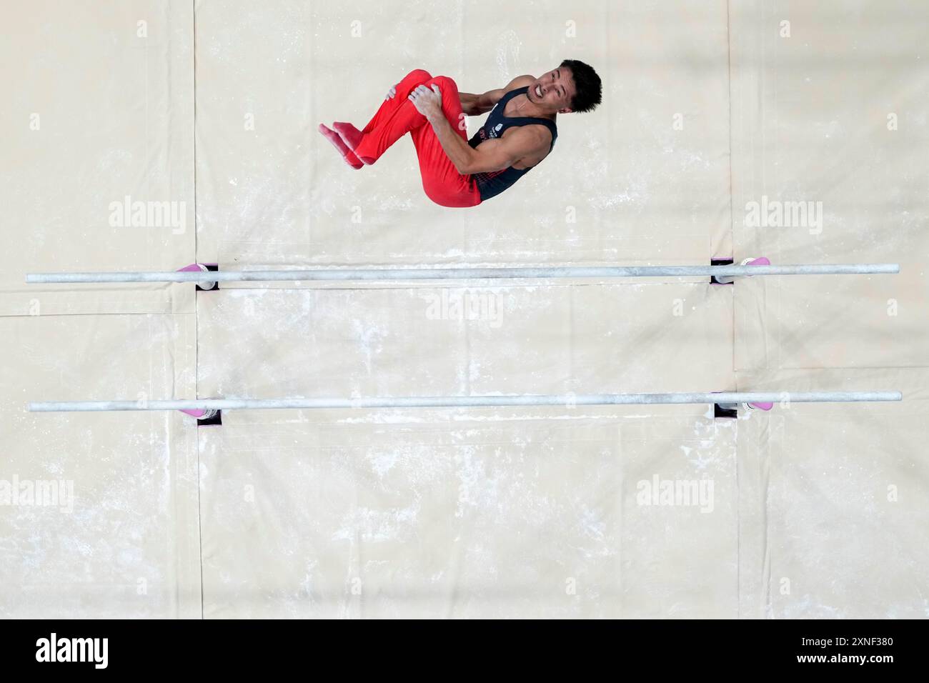 Jake Jarman, of Britain, performs on the parallel bars during the men's ...