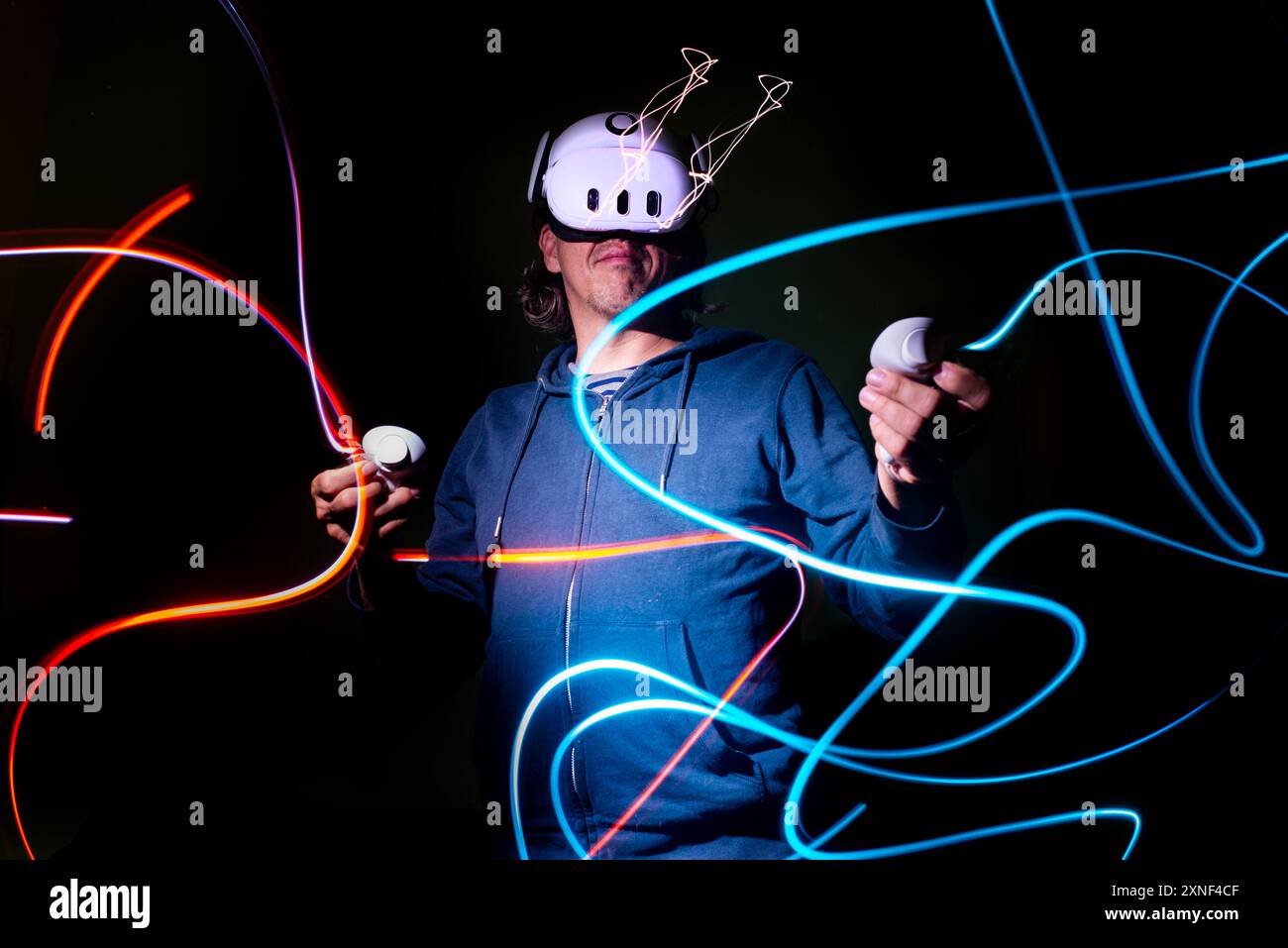 Man wearing a Meta Quest 3 headset immersed in virtual reality ...