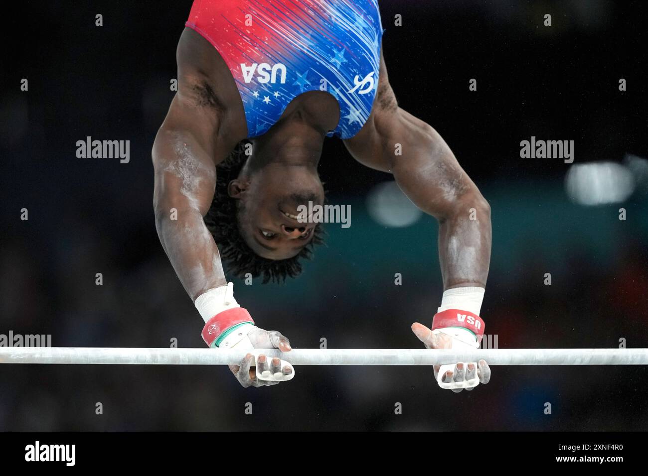 Frederick Richard, of the United States, performs on the horizontal bar ...
