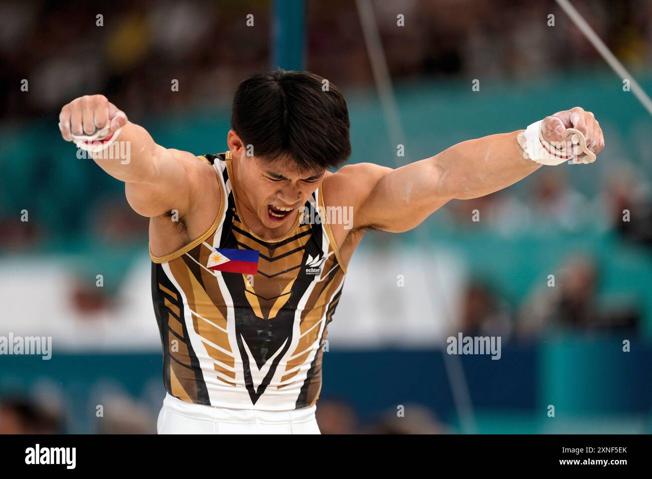 Carlos Edriel Yulo, of the Philippines, celebrates after performing on ...