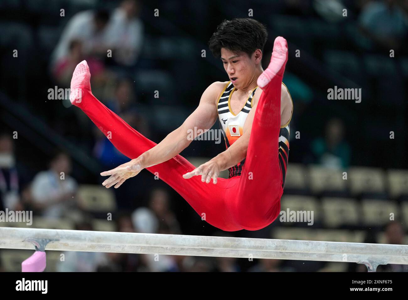 Daiki Hashimoto, of Japan, performs on the parallel bars during the men ...