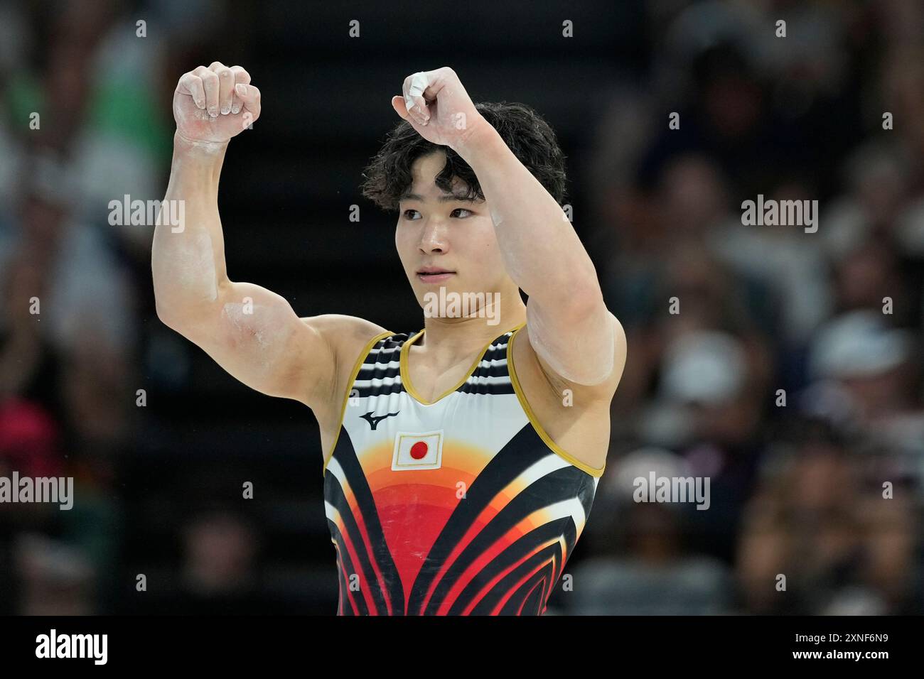 Shinnosuke Oka, of Japan, celebrates after performing on the parallel ...