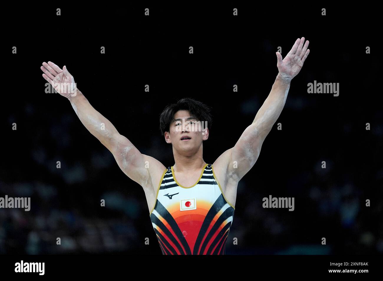 Daiki Hashimoto, of Japan, raises his arms after performing on the ...