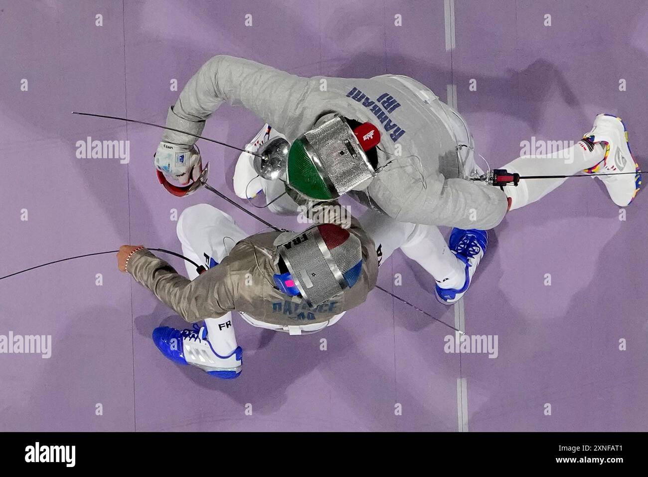 Iran's Mohammad Rahbari, right, and France's Sebastien Patrice compete ...