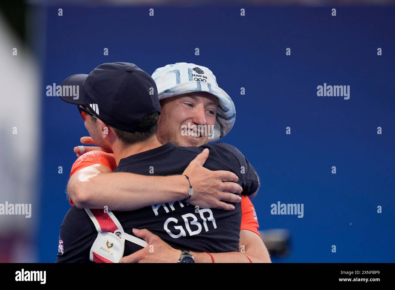 Britain's Tom Hall hugs his teammate Conor Hall, right, after a win ...