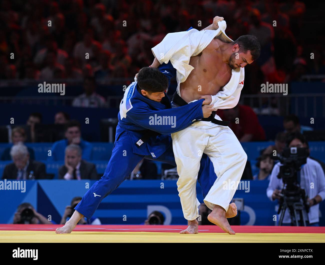Paris, France. 31st July, 2024. Lasha Bekauri (white) of Georgia ...