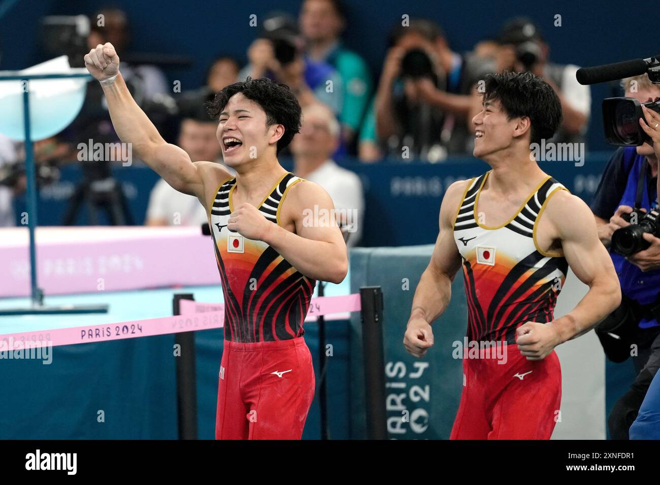 Shinnosuke Oka, left, and Daiki Hashimoto, of Japan, right, celebrate after Oka won the gold ...